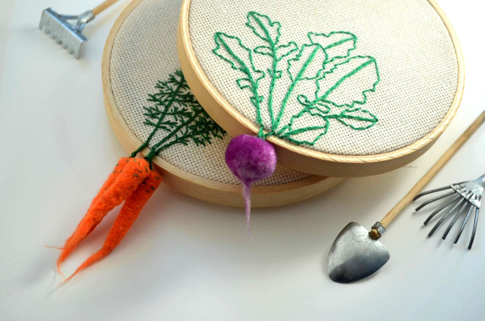 Appetising embroidery art that has crafted vegetables dangling from the ...