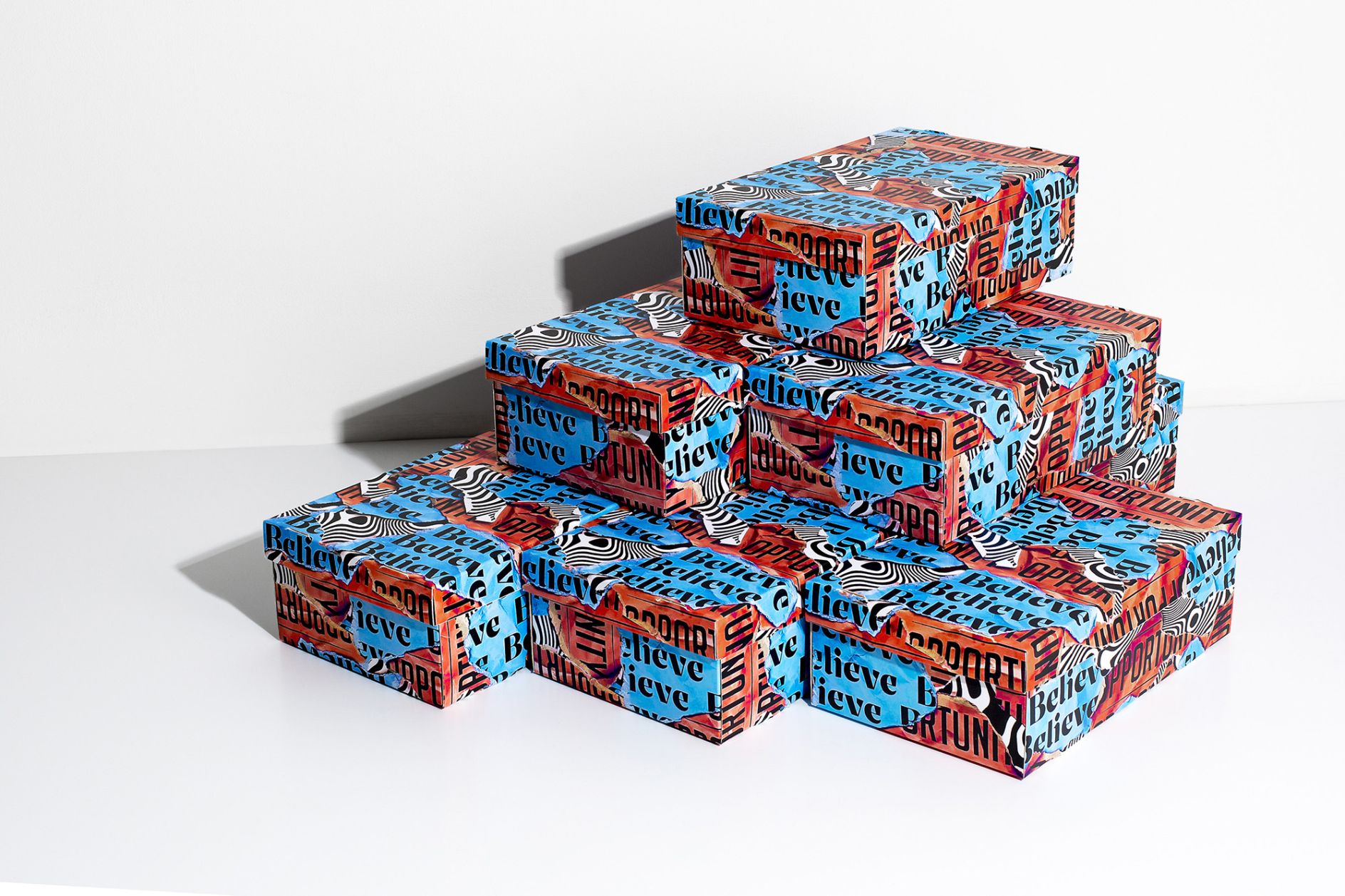 Craig Black creates typographic boxes for sports shoe charity ...