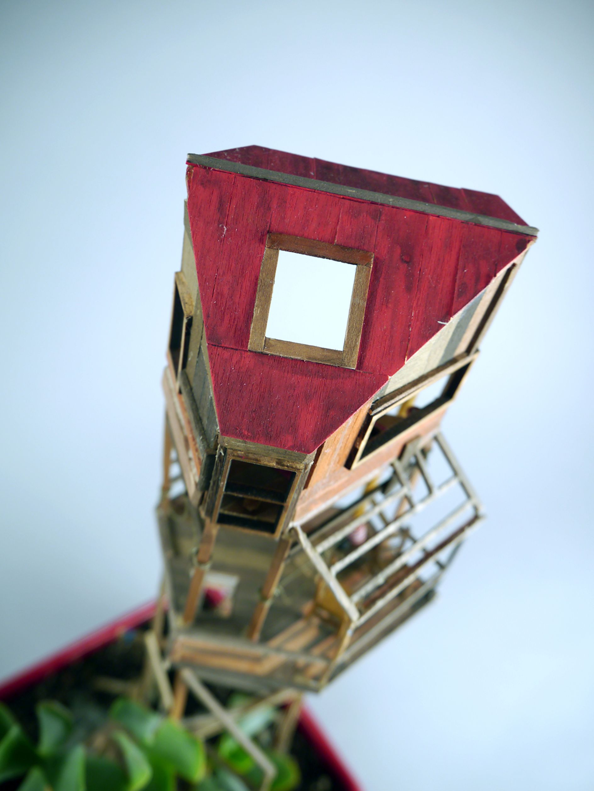 Artist crafts miniature treehouse sculptures to sit within ordinary ...