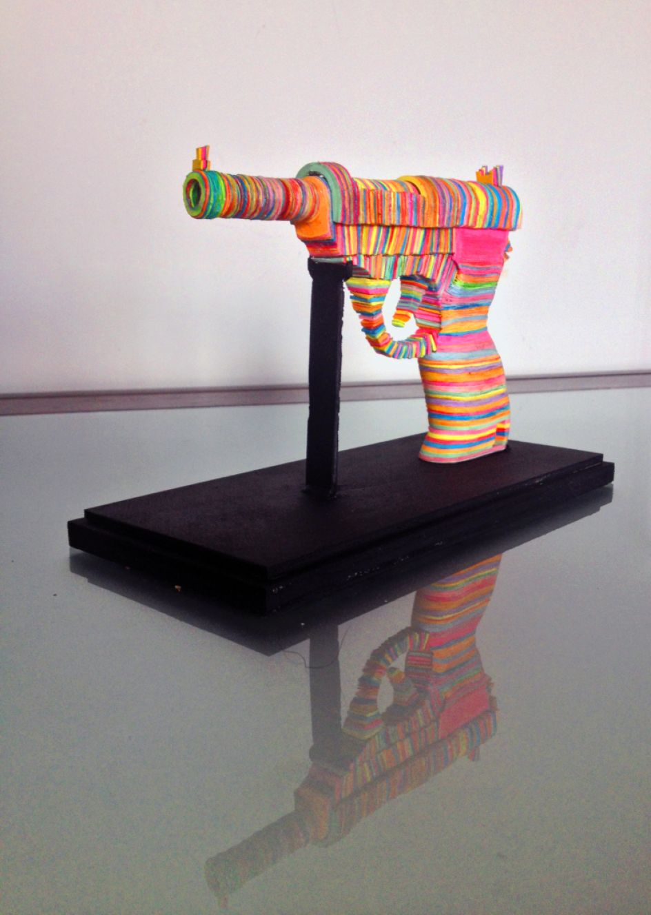 Artist crafts colourful weapon sculptures out of tens of thousands of ...