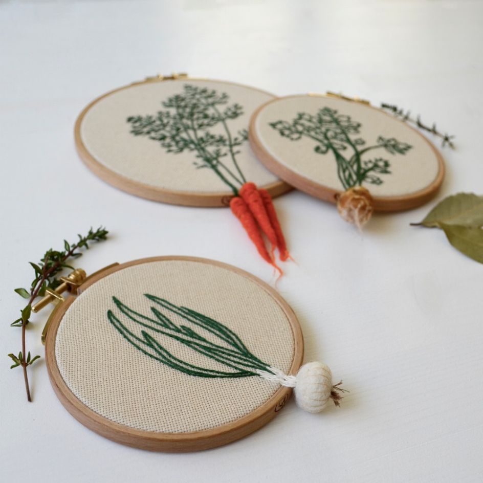 Appetising embroidery art that has crafted vegetables dangling from the ...