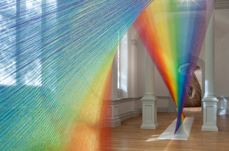 Artist weaves 60 miles of colourful thread to create spectacular indoor ...