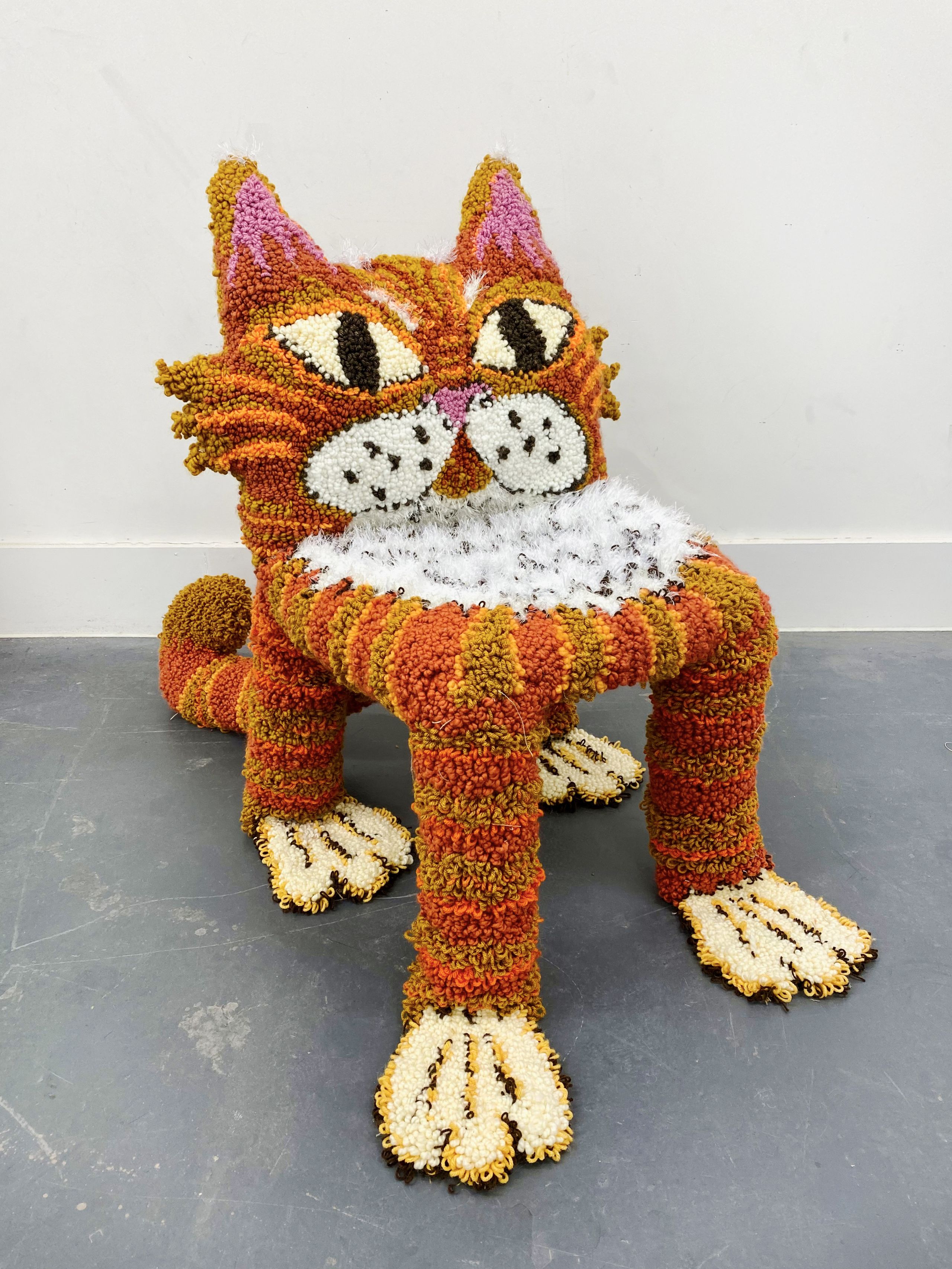 Cradle: Playful tufted chairs and stools shaped like cats offer comfort ...