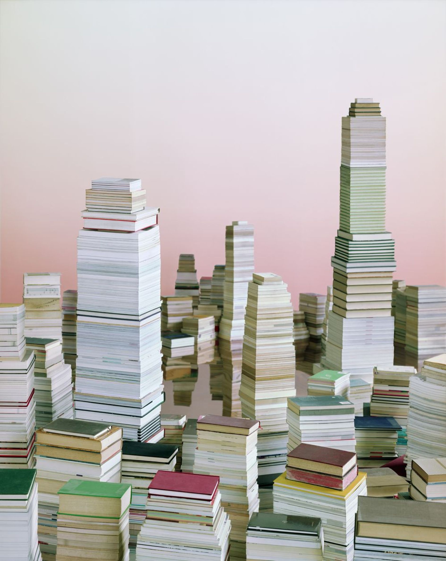 City skylines and mountainous landscapes made entirely from old books ...