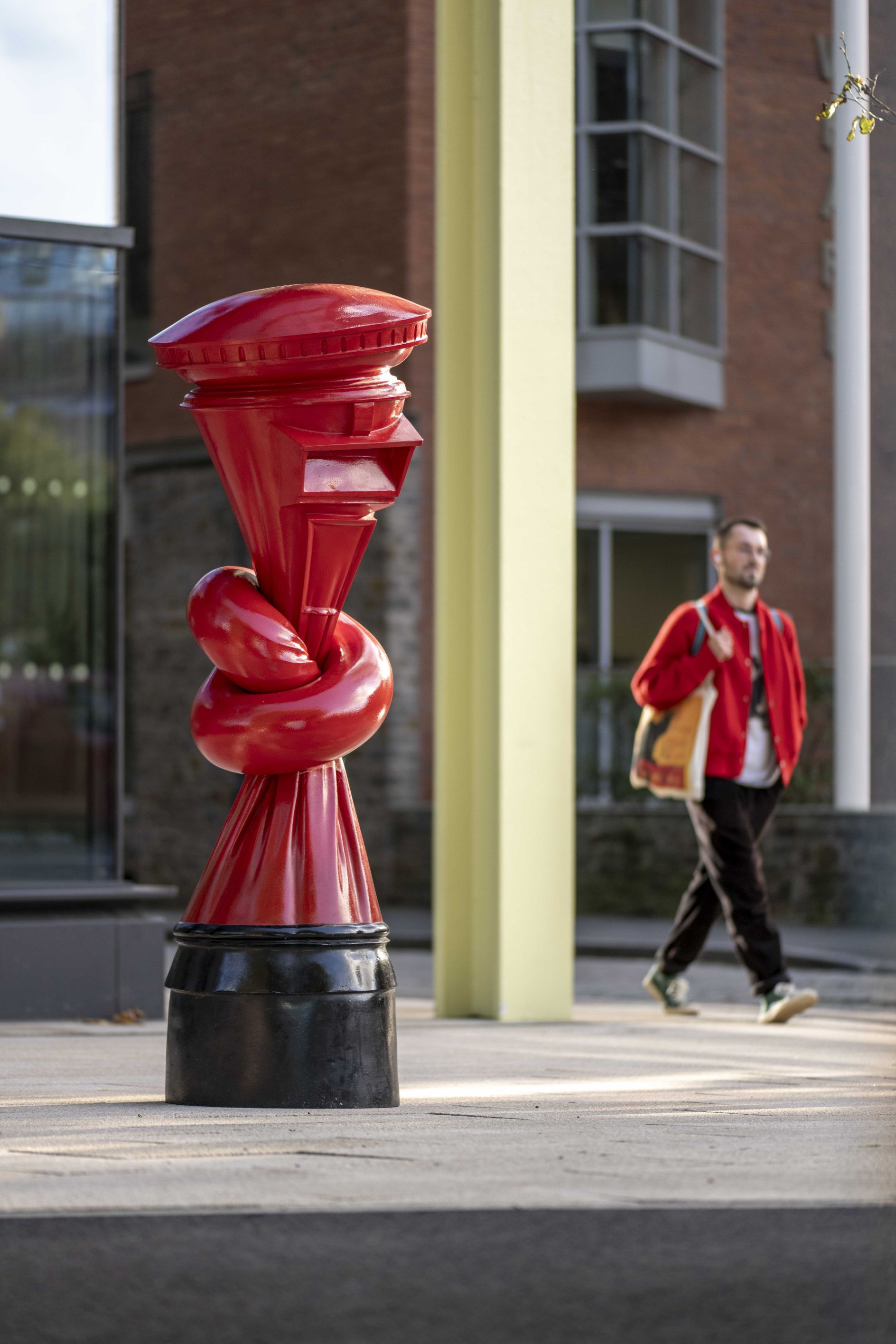 Alex Chinneck's twisted trail of street furniture light up a new corner ...