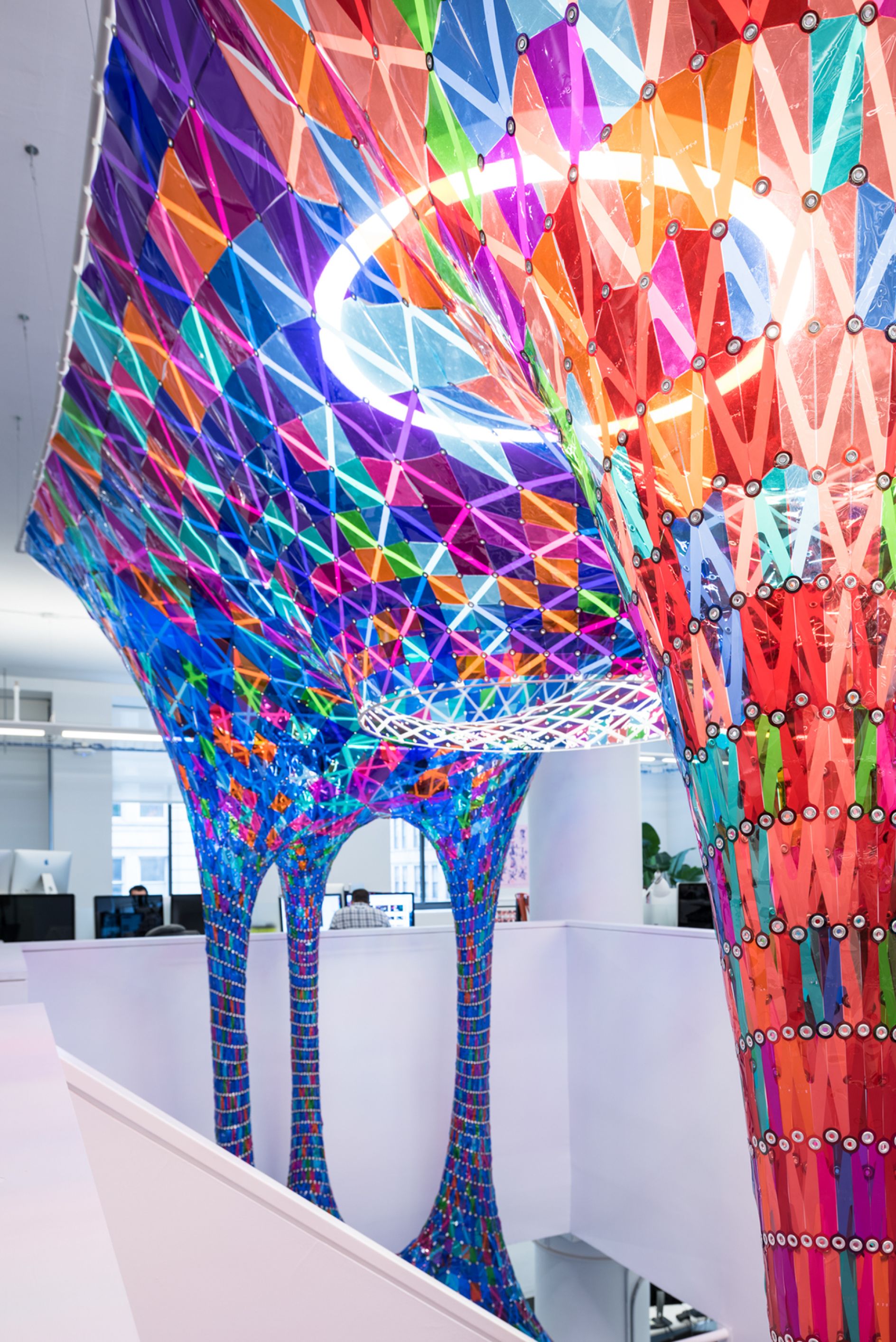 Stain glass art installation that hangs through two floors of Behance's ...