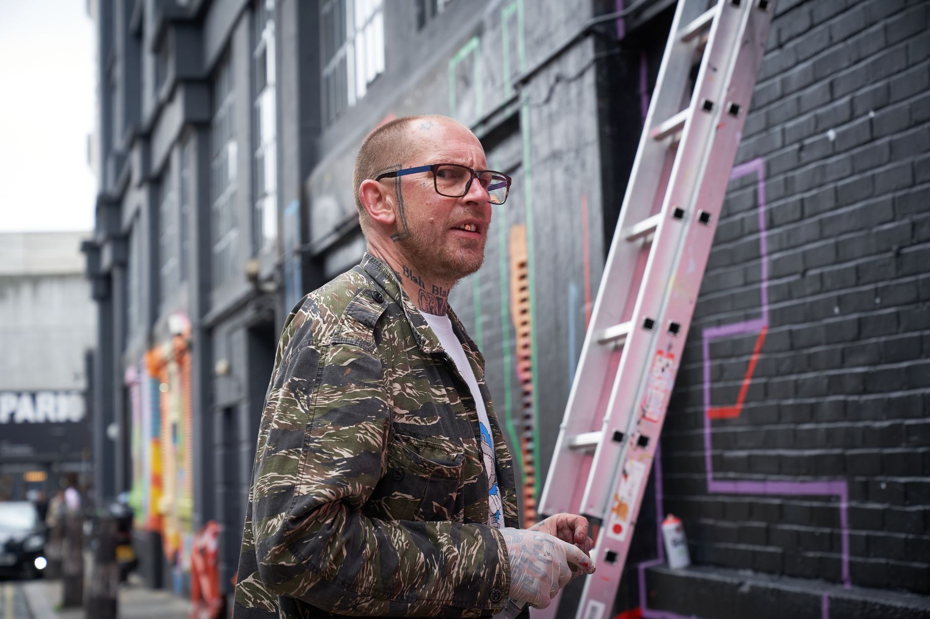 Street artist Ben Eine paints a huge 'Love' mural to bring a little ...