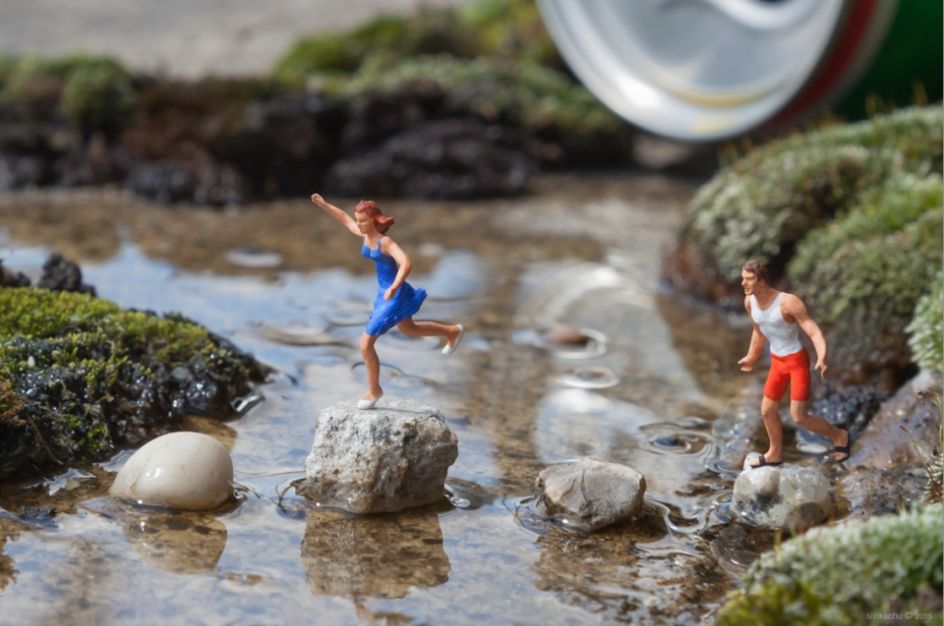 A global model village with miniature people at your feet, captured on ...