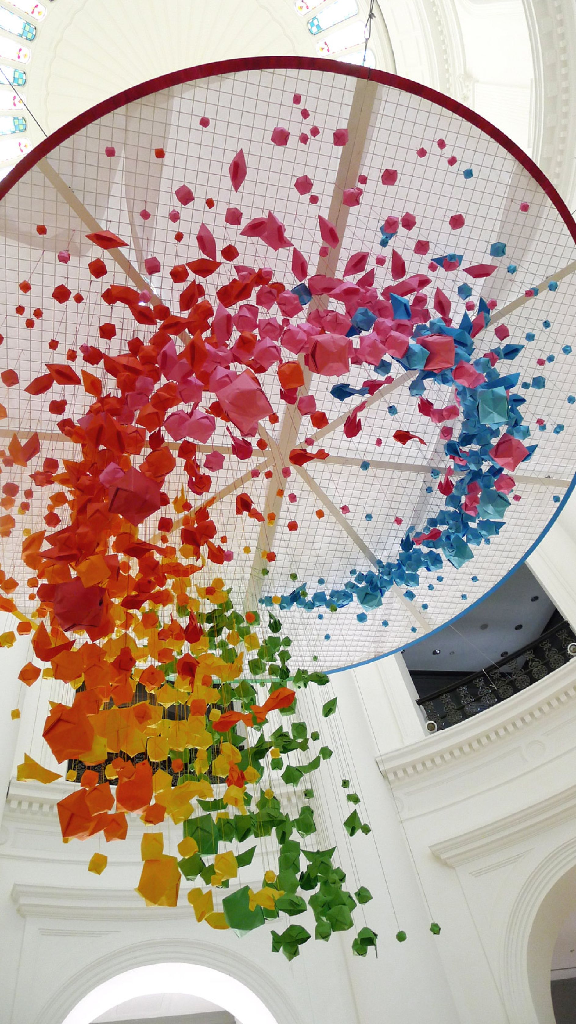 Giant, rainbow hanging installation of 1,000 origami spheres, fish and ...
