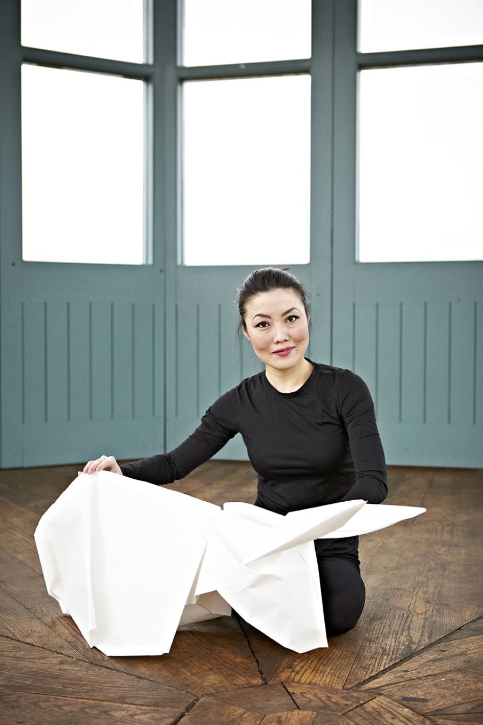 Artist Coco Sato folds a larger-than-life, giant origami rabbit ...