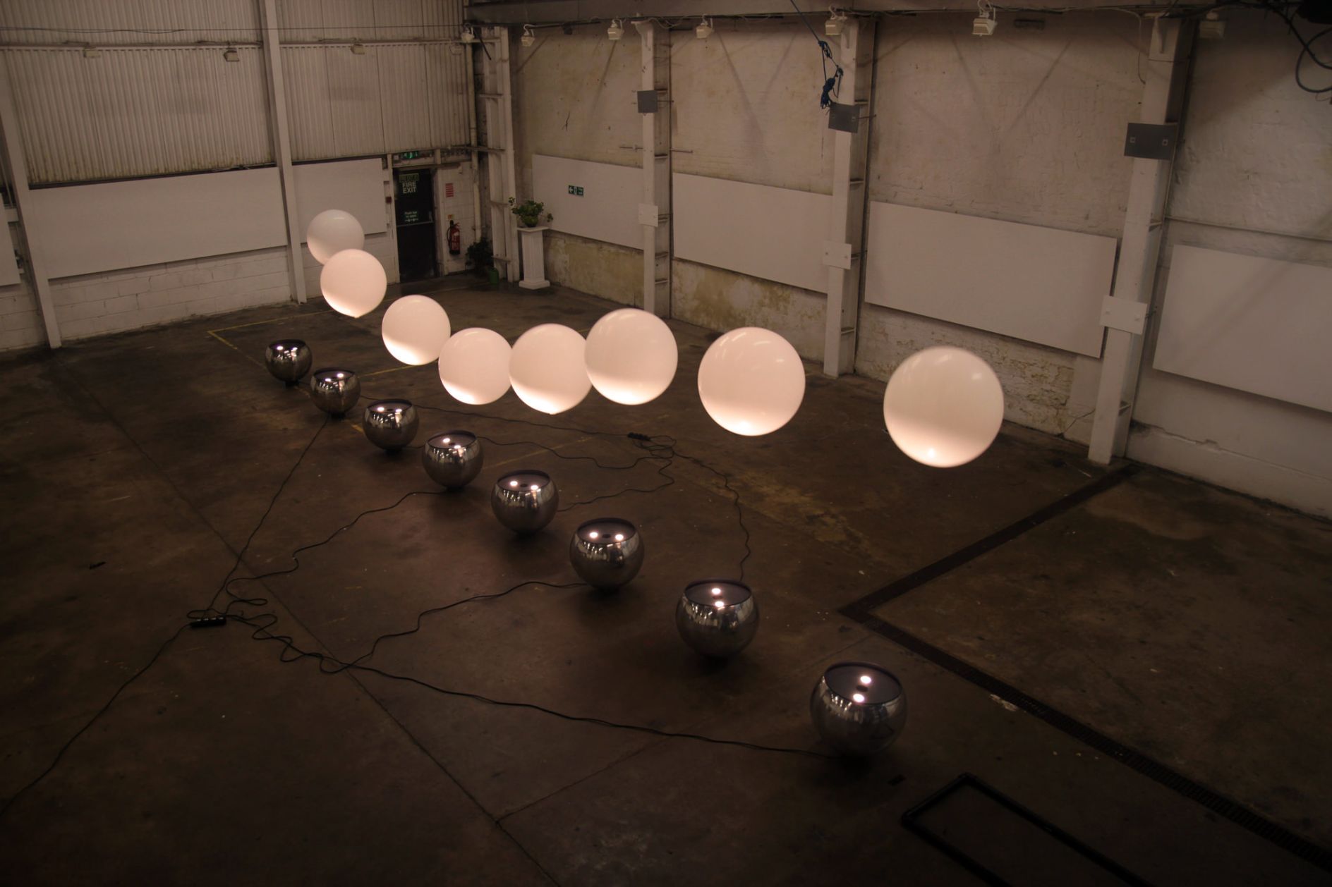 Interactive installation that lets you play with giant colourful orbs ...