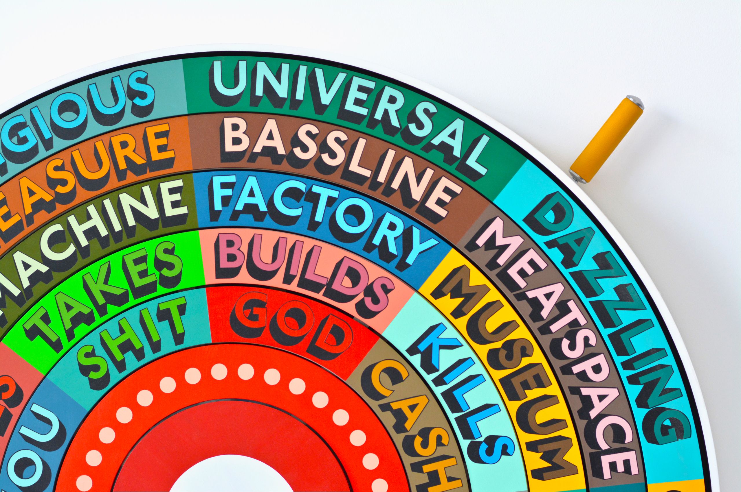 A rainbow-coloured wheel of fortune by artist Tim Fishlock that helps ...