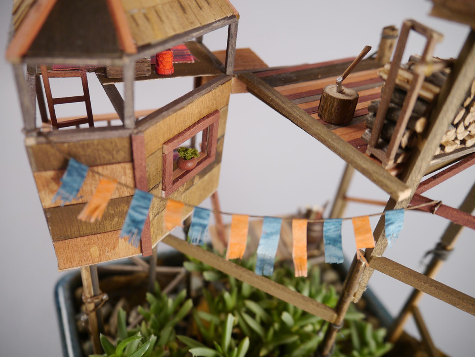 Artist crafts miniature treehouse sculptures to sit within ordinary ...
