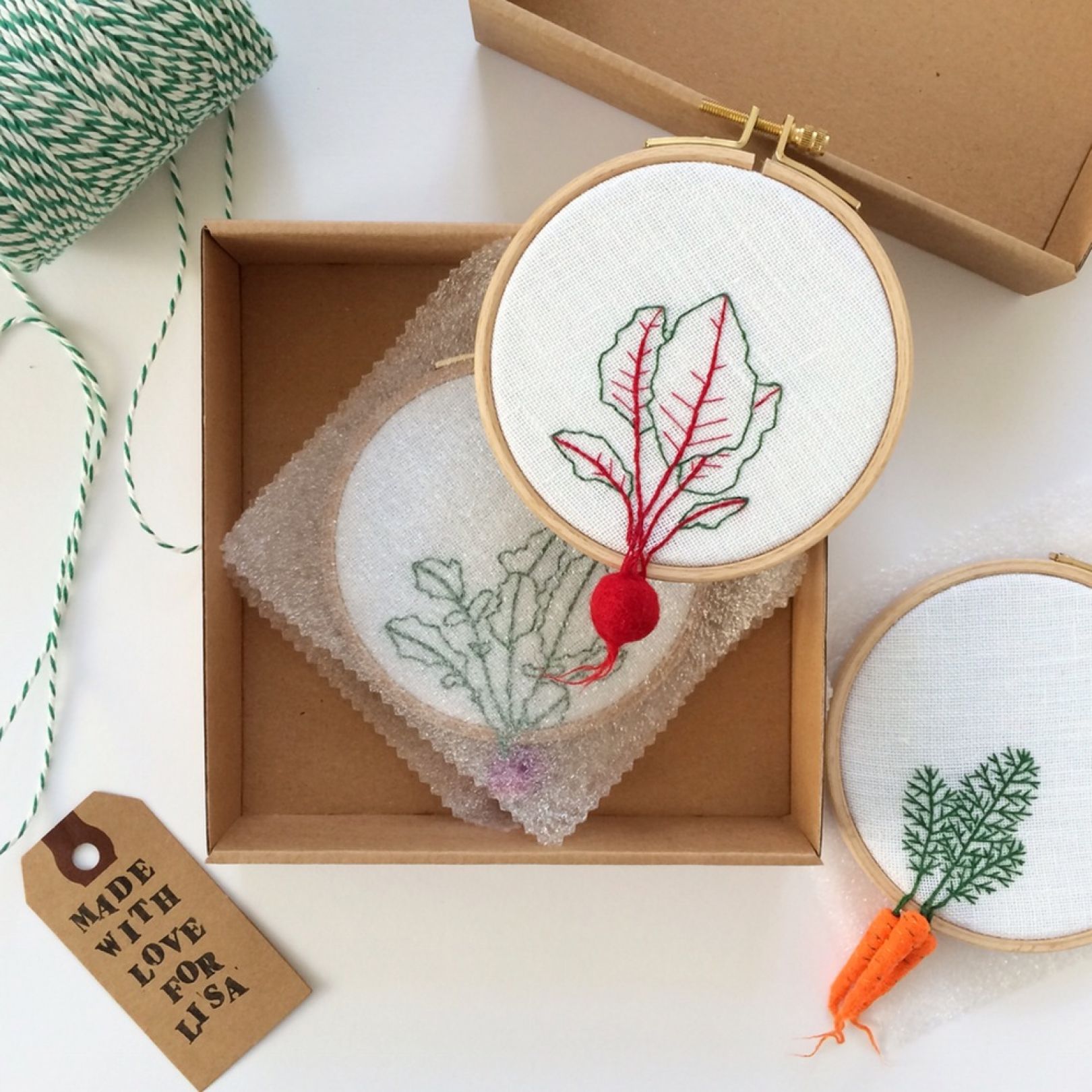 Appetising embroidery art that has crafted vegetables dangling from the ...
