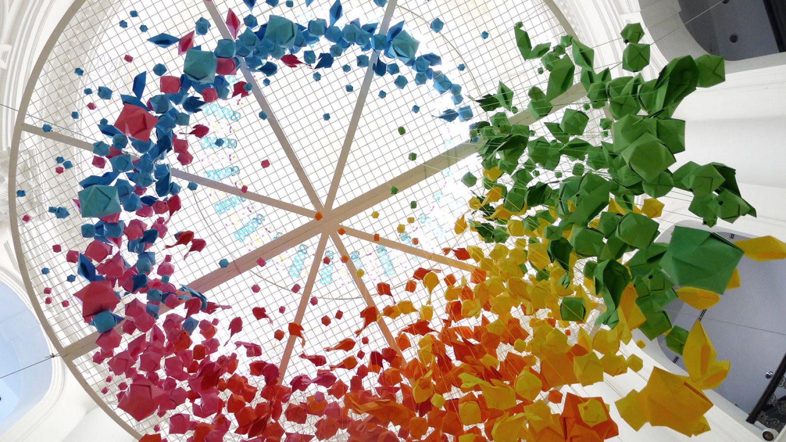 Giant, rainbow hanging installation of 1,000 origami spheres, fish and ...