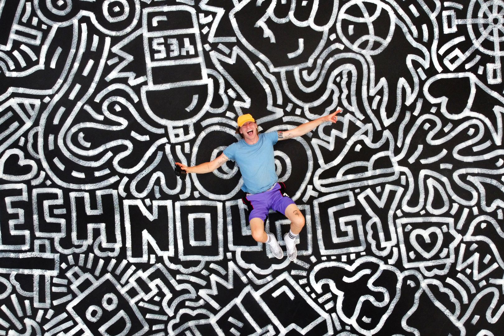 Timothy Goodman paints an entire basketball court for children at a ...