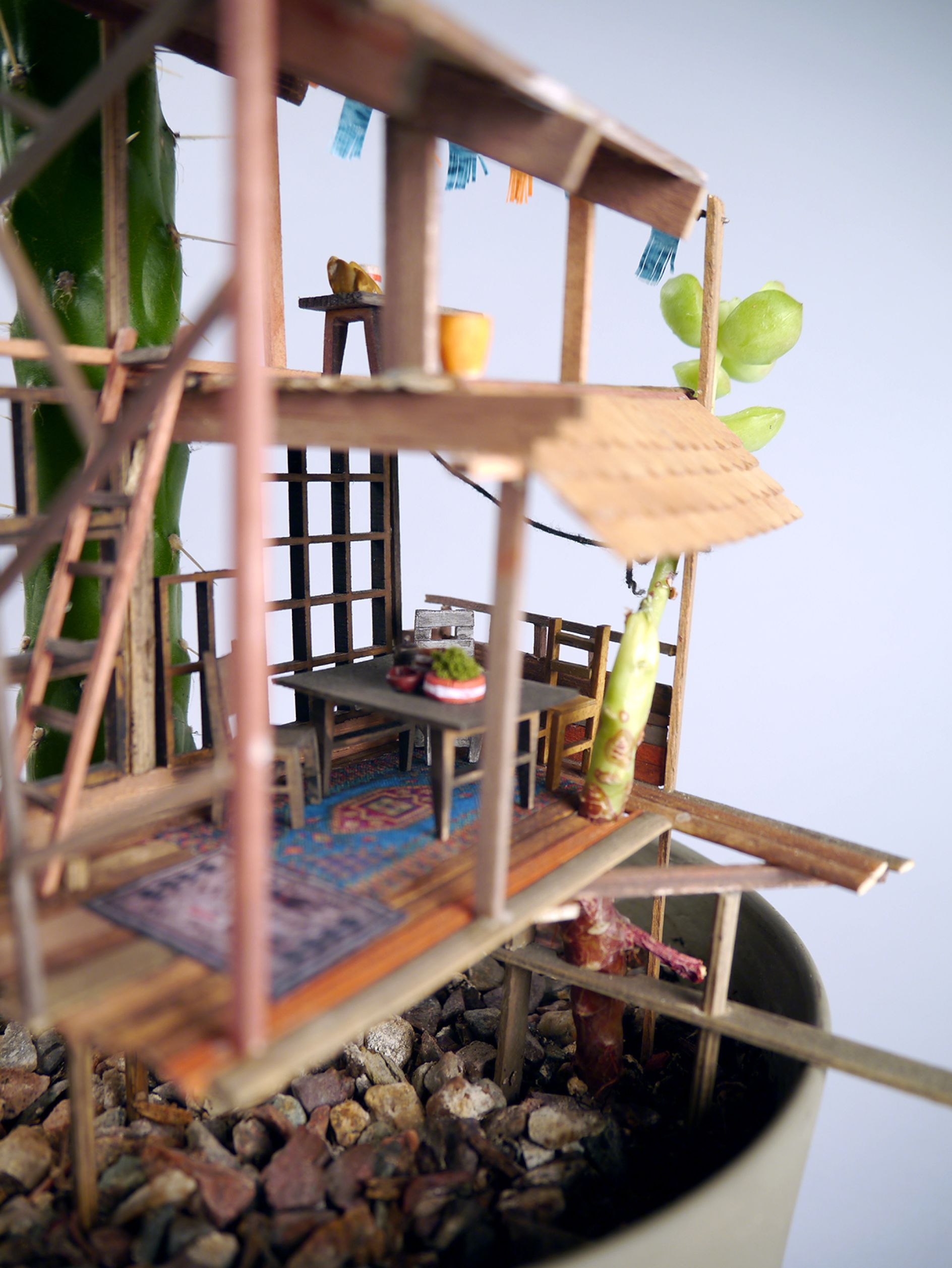Artist crafts miniature treehouse sculptures to sit within ordinary ...