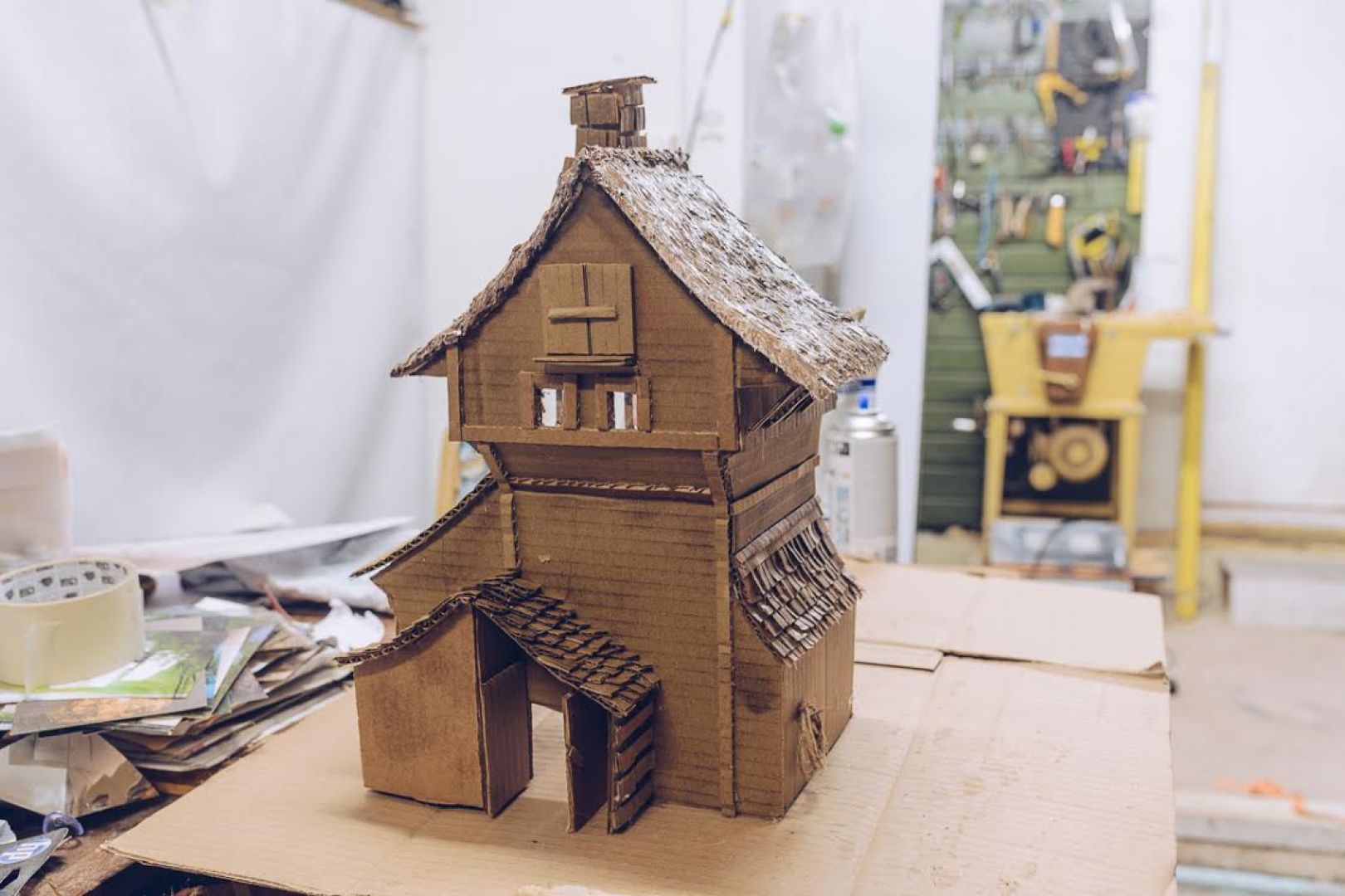 Miniature cardboard models that are photographed to look like the real ...