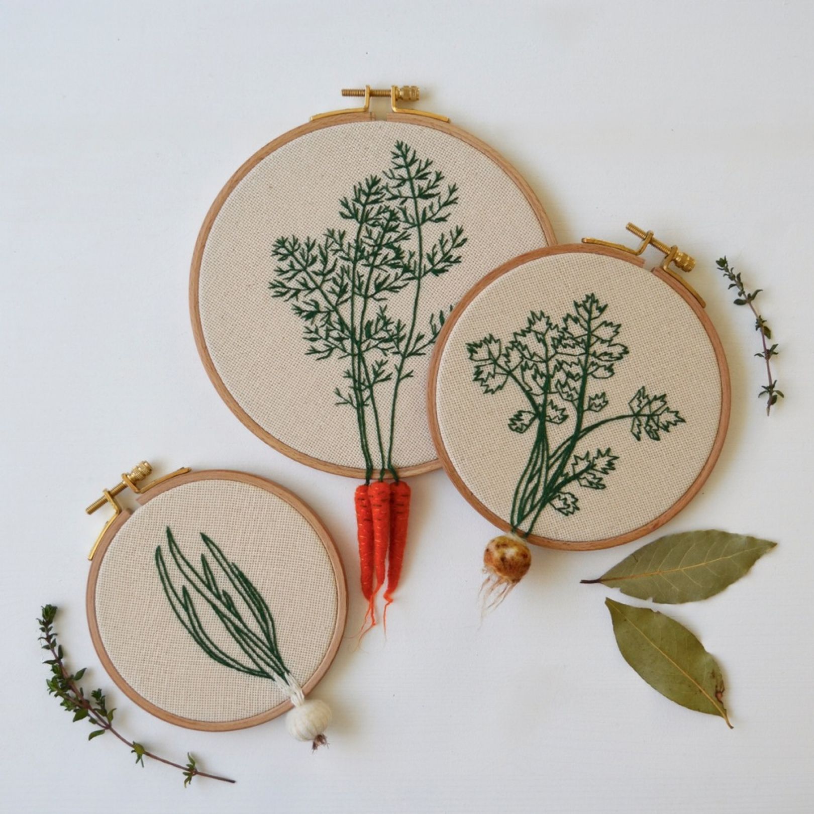 Appetising embroidery art that has crafted vegetables dangling from the ...