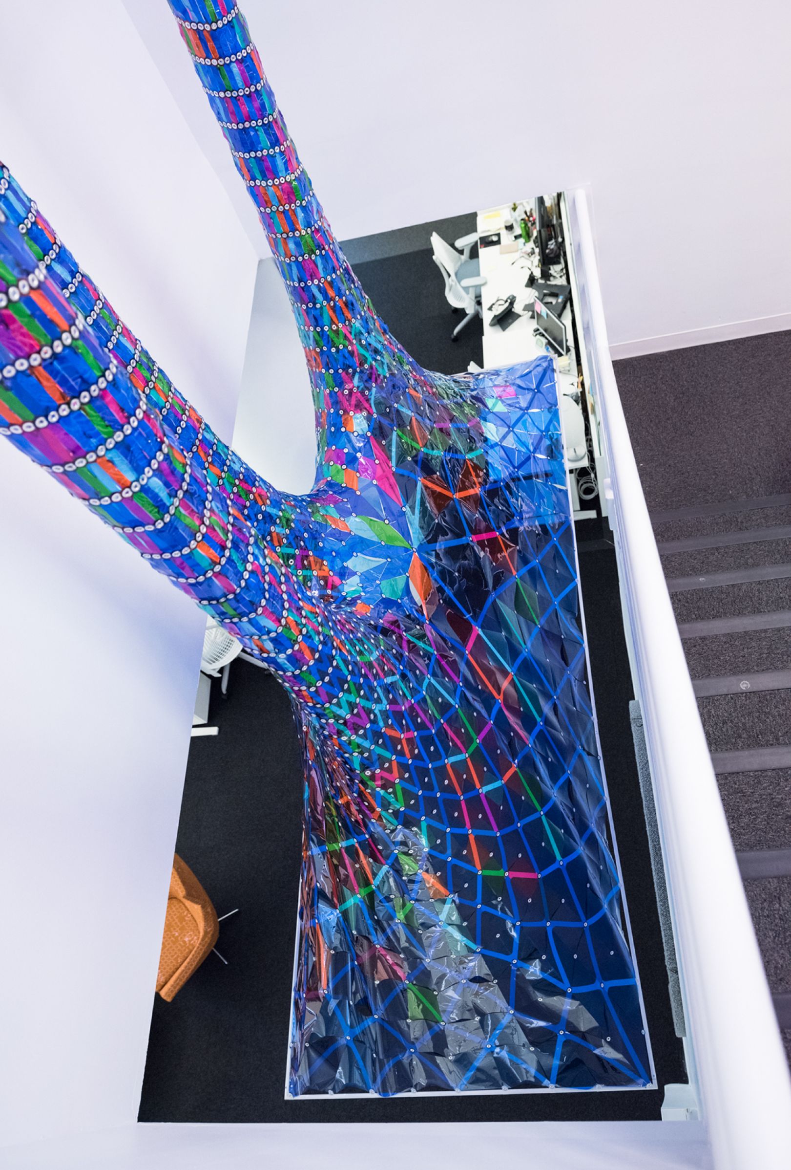 Stain glass art installation that hangs through two floors of Behance's ...