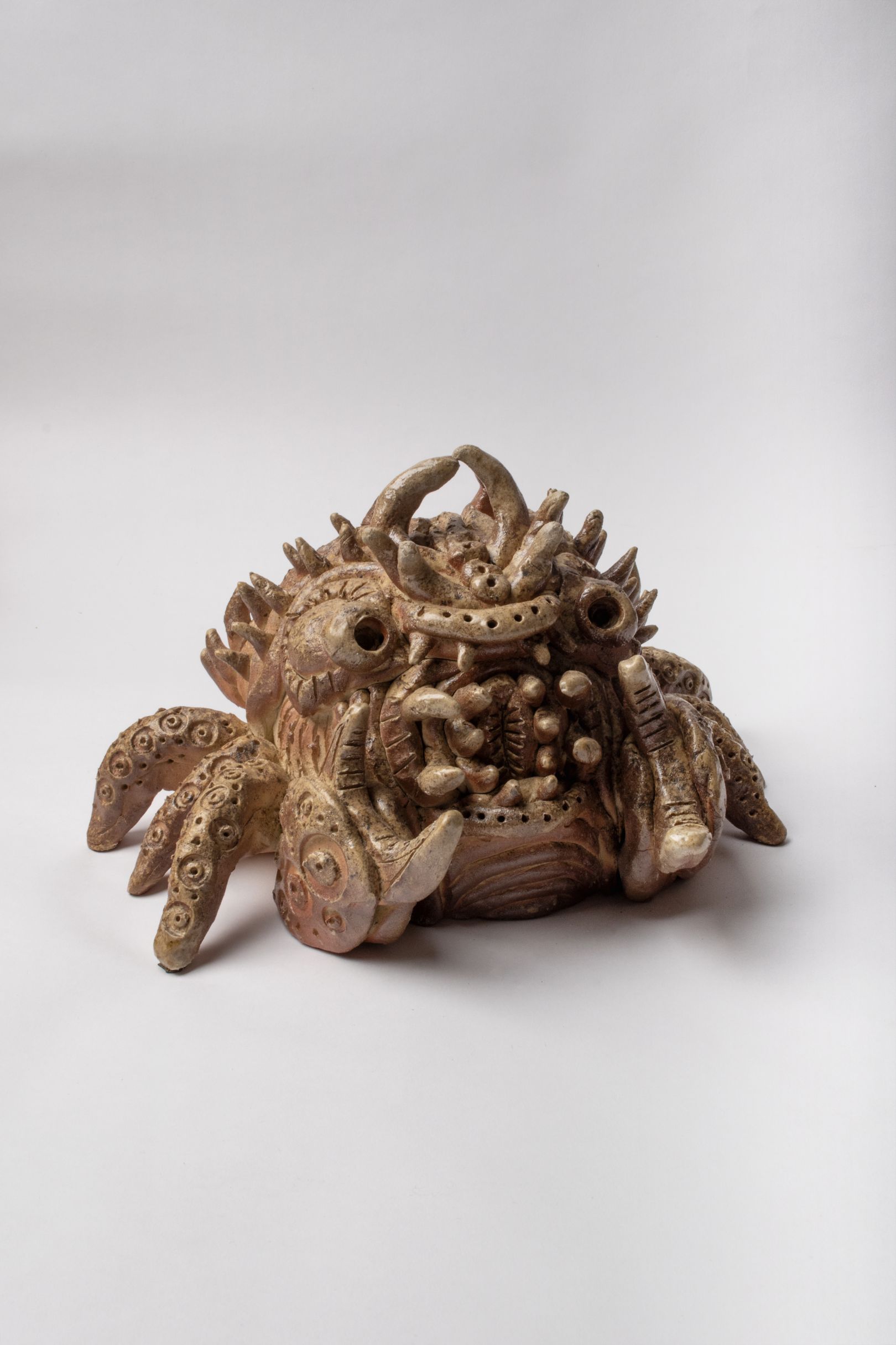 Spiky ceramic creatures and demons, painstakingly crafted by hand ...