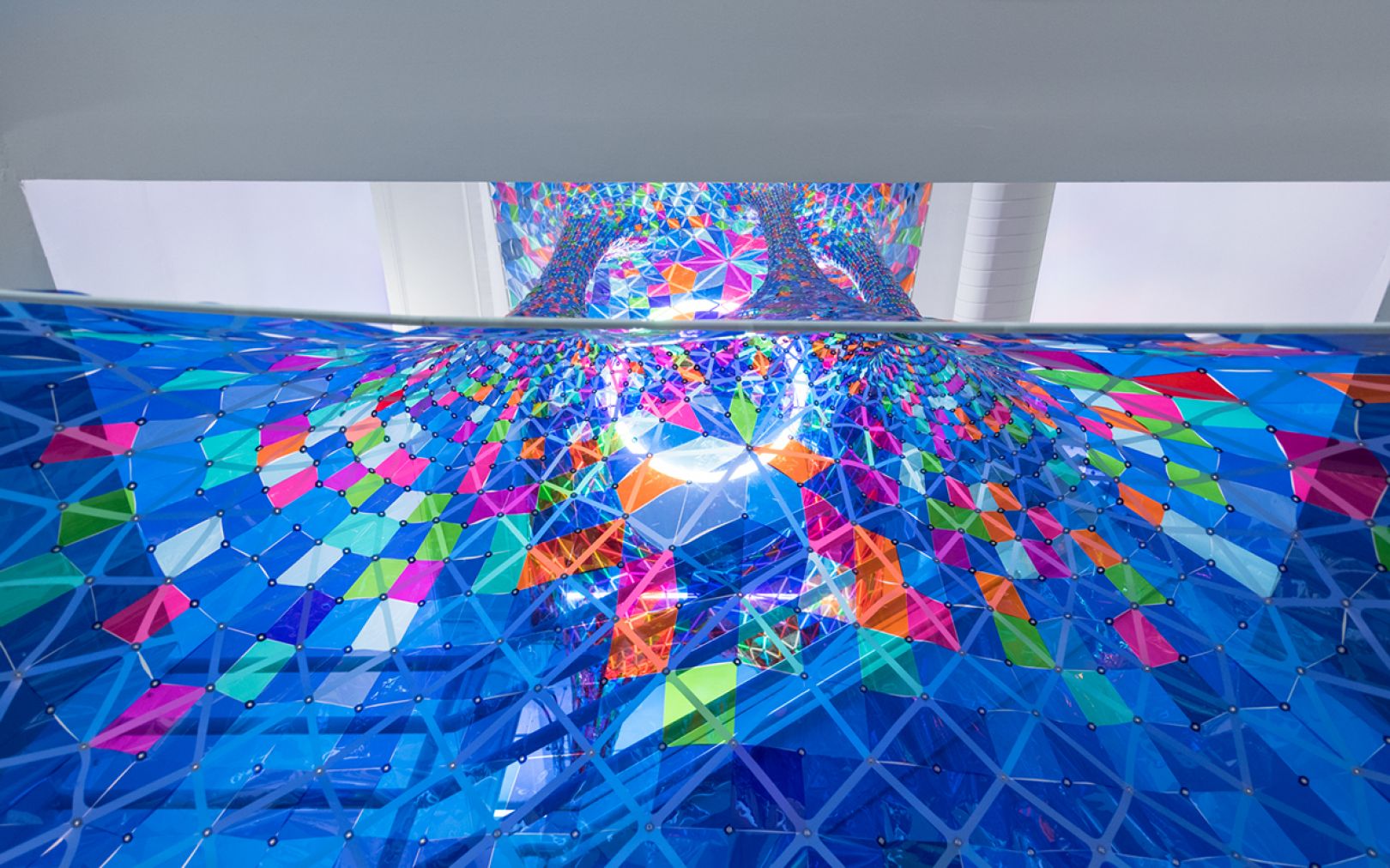 Stain glass art installation that hangs through two floors of Behance's ...