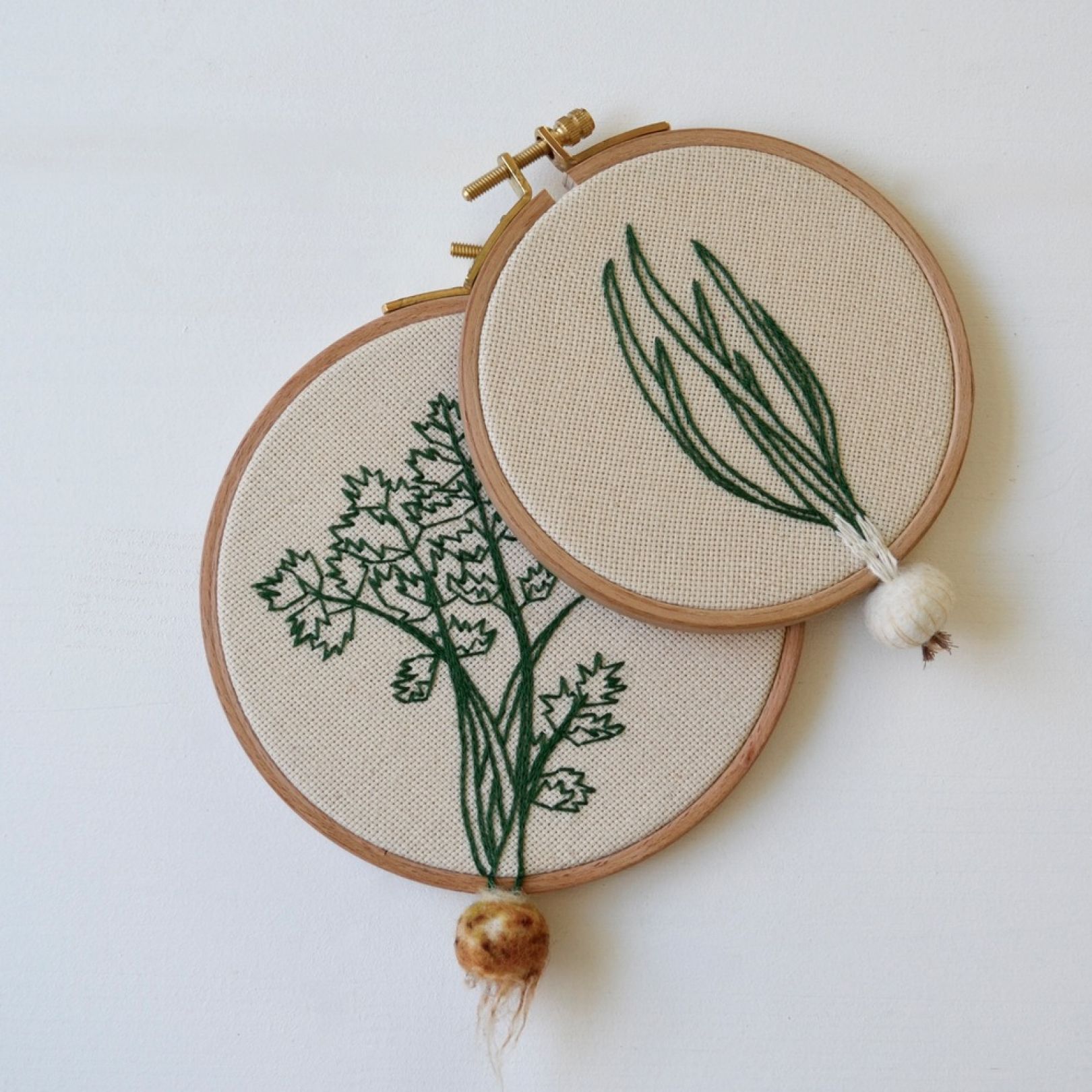 Appetising embroidery art that has crafted vegetables dangling from the ...