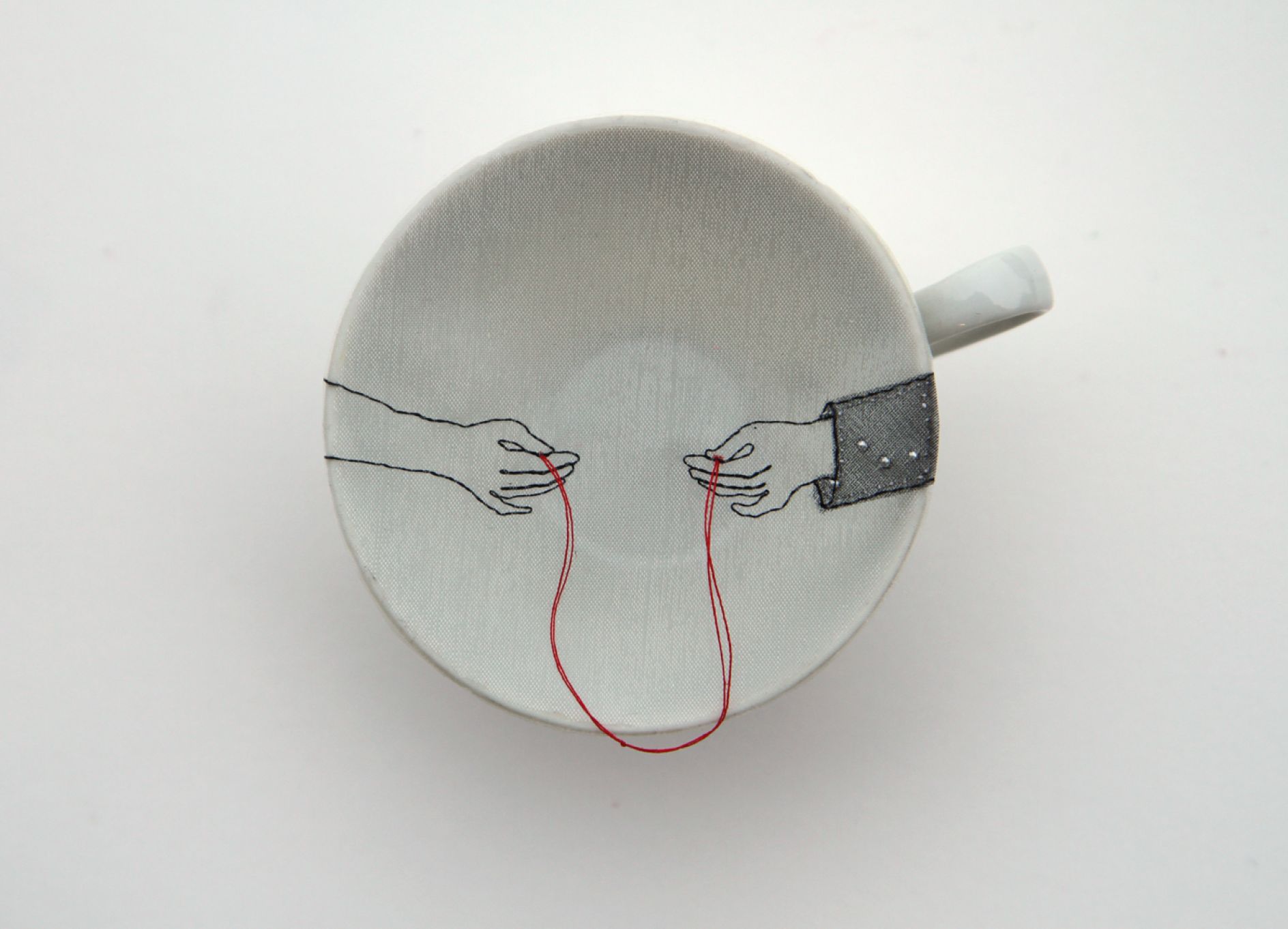 Artist combines ceramics with embroidered artwork to create delicate ...