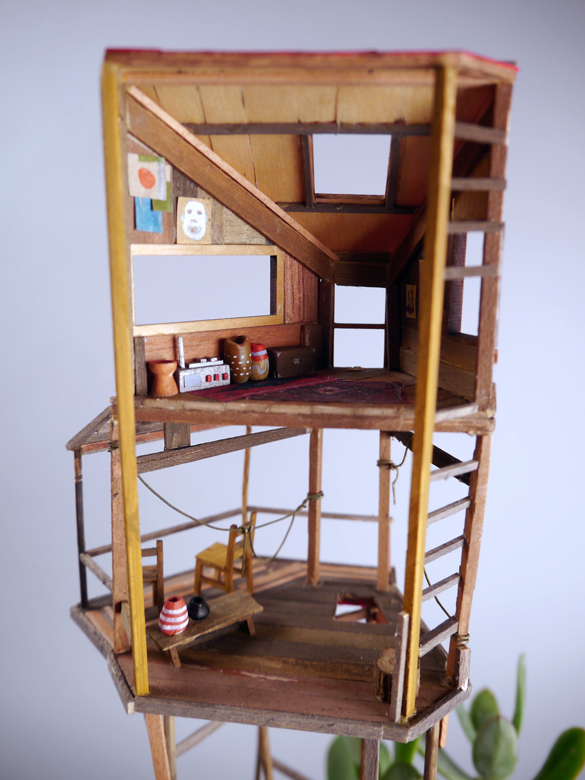 Artist crafts miniature treehouse sculptures to sit within ordinary ...